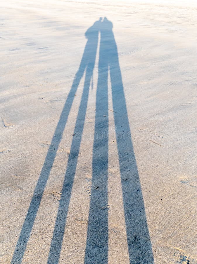 Funny Shadows of Couple on the Beach with Deep Sunlight Stock Photo ...