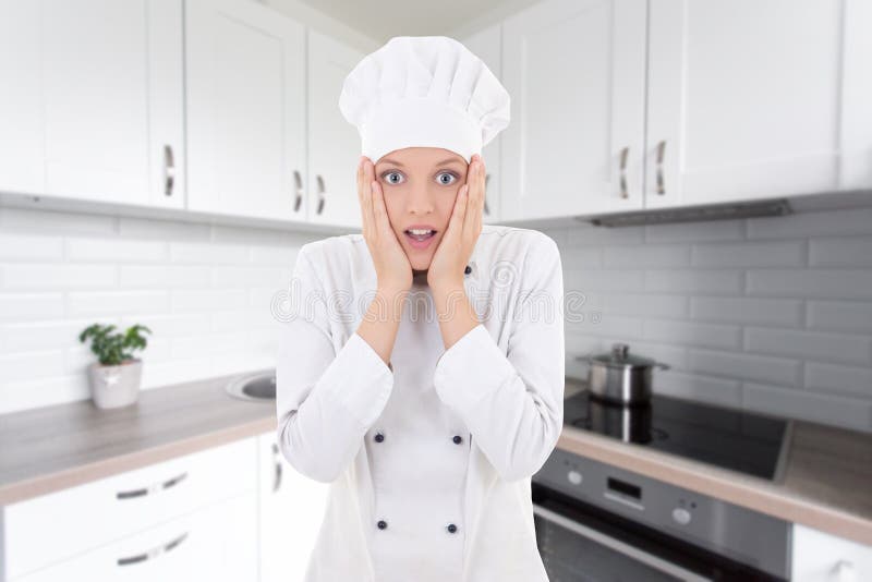 Funny Shocked Woman in Chef Uniform in Modern Kitchen Stock Photo ...