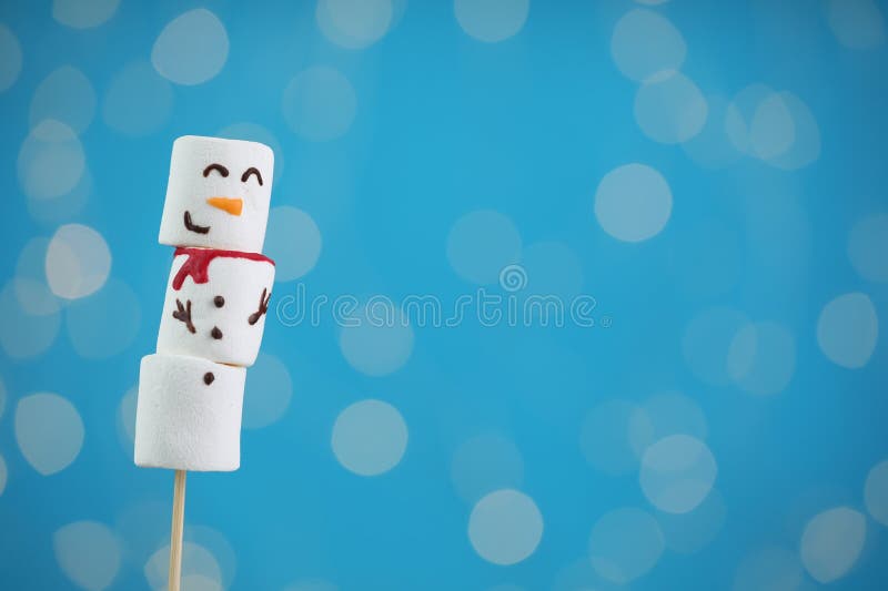 Funny Snowman Made of Marshmallows on Blue Background with Blurred Lights. Space for Text Stock ...