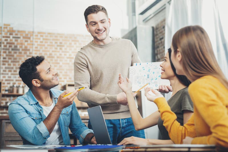 Jolly Four Students Exchanging Ideas Stock Photo - Image of community ...