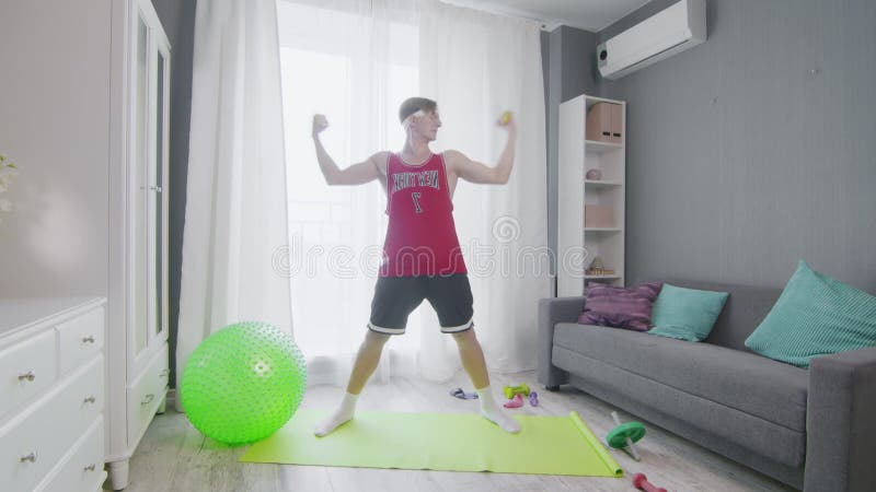 Funny Stupid-looking Guy Doing Workout Exercises on Biceps with Bananas ...