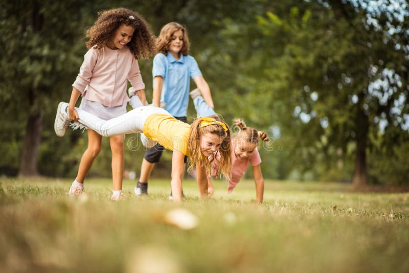 Funny Time. Group of School Kids Having Fun in Nature Stock Photo ...