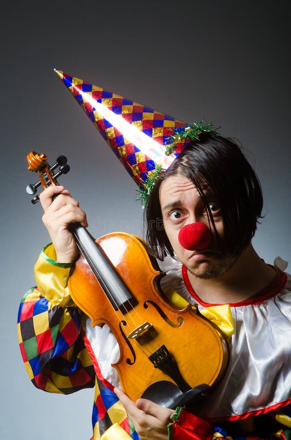 The Funny Violin Clown Player in Musical Concept Stock Photo - Image of ...