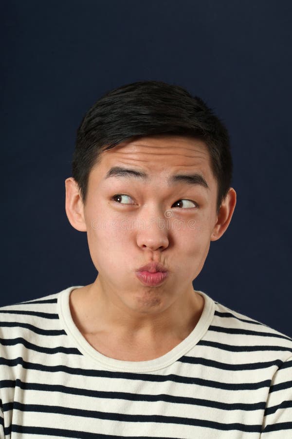 Funny Young Asian Man Making Face and Looking Sideways Stock Image ...