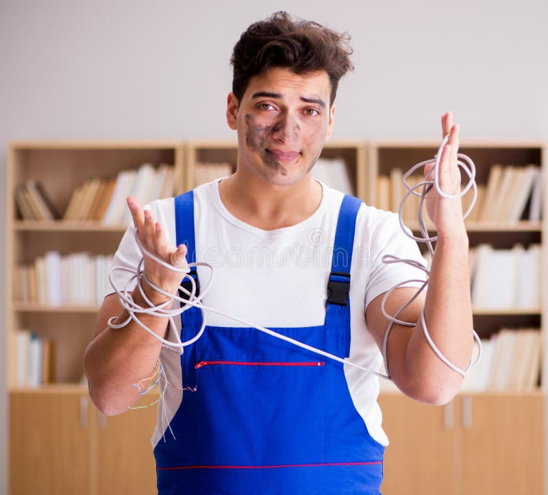 Funny Young Electrician Tangled in Cables Stock Image - Image of ...