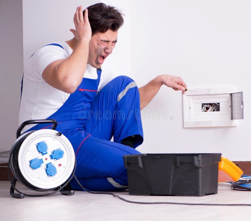 Funny Young Electrician Working on Socket at Home Stock Photo - Image ...