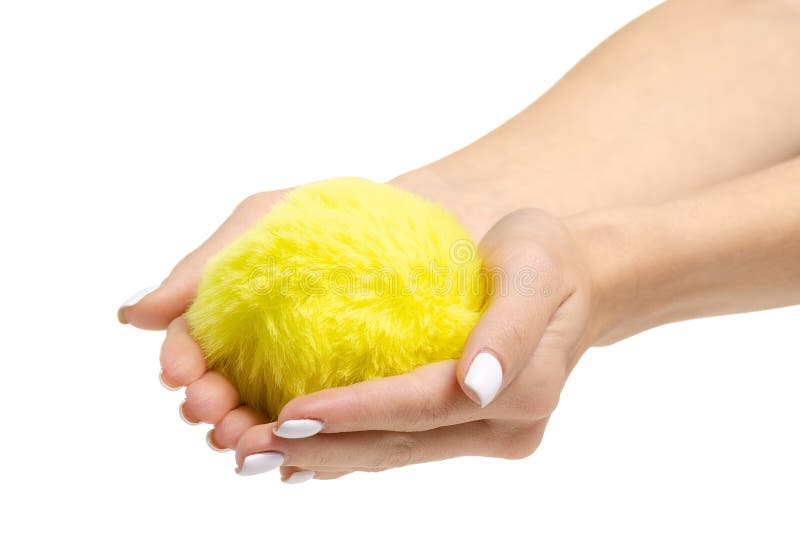 Fur ball yellow in hand stock photo. Image of design - 129166080