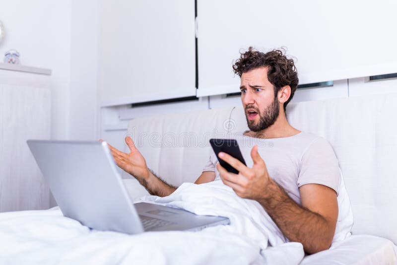 Furious Man in Bed Angry about Bad News Online or Pc Software Failure ...