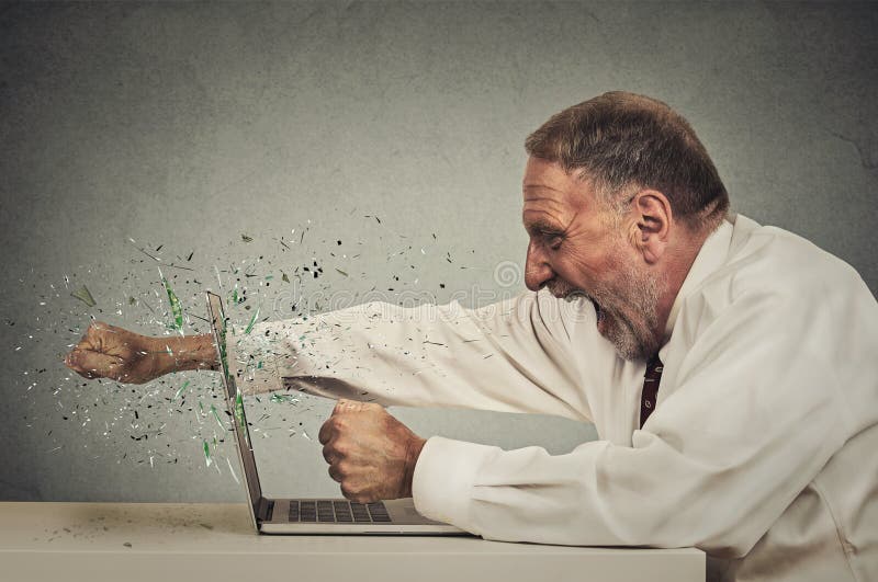 Furious Senior Businessman Throws Punch into Computer Stock Photo ...