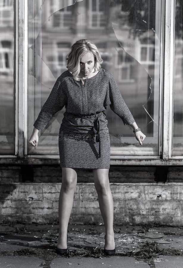 Furious Woman in Aggressive Posture Near Broken Window Stock Photo ...