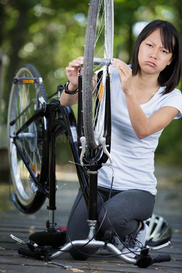 Furious Woman Trying To Fix Bike Problem Stock Photo - Image of sunny ...