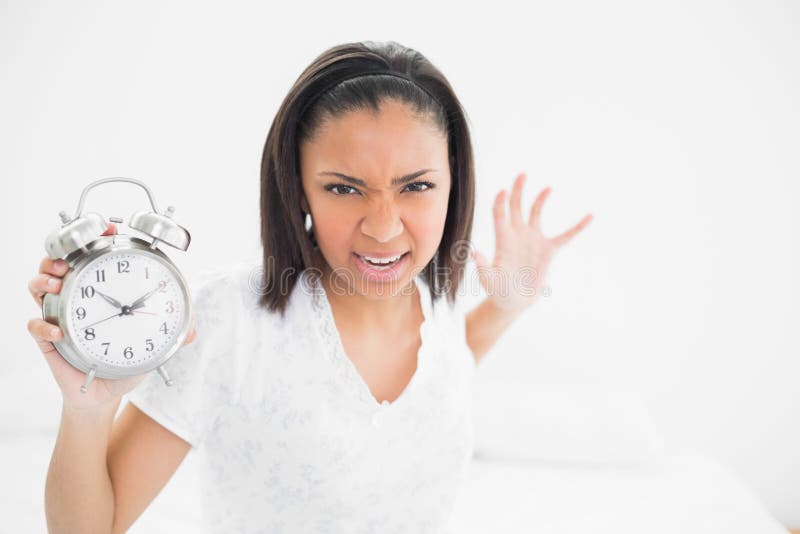 Furious Young Dark Haired Model Throwing an Alarm Clock Stock Image ...