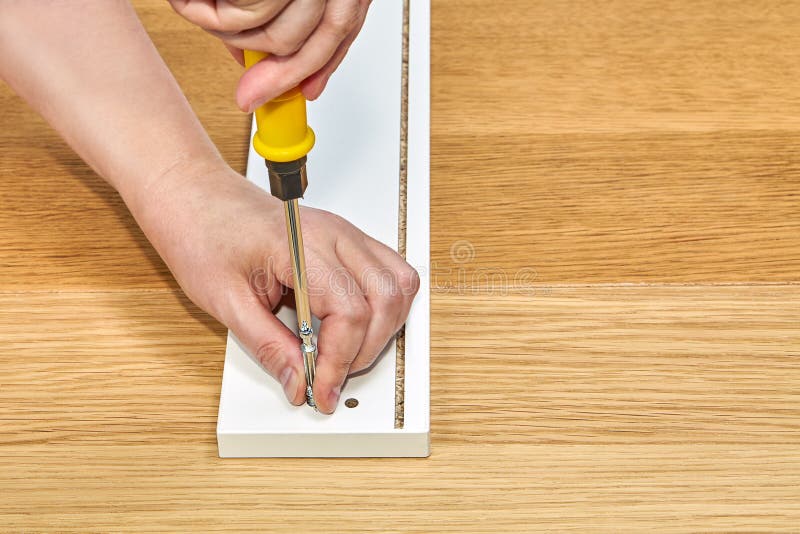 Furniture Assembler Uses Connecting Dowel Pin, Close-up. Stock Image ...