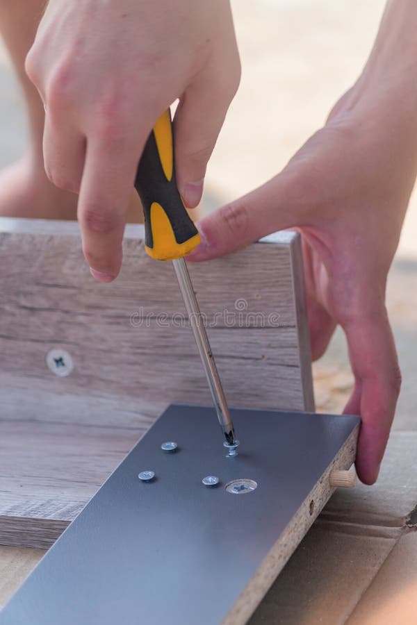 Furniture Assembling - Carpentry Screws for a Knock Down Wooden Table ...