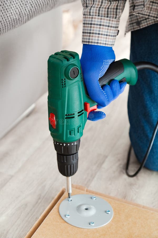 Furniture Assembly Process, Master Collects Table Furniture Using Drill ...