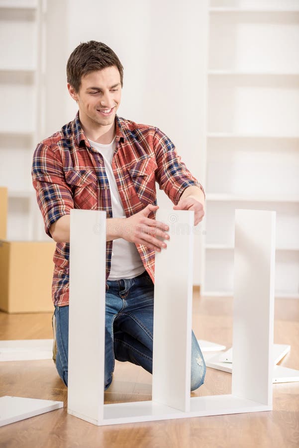 Furniture installation stock photo. Image of holding - 54948786