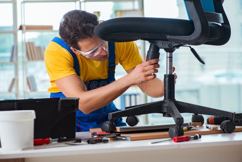 The Furniture Repairman Working On Repairing The Chair Stock Image