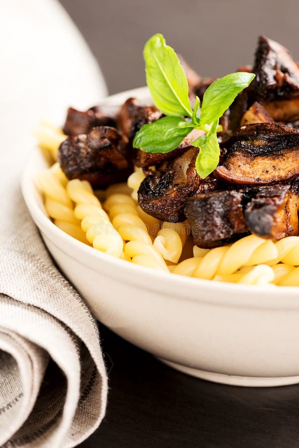 Fusilli with mushrooms stock image. Image of fried, bright - 59877013