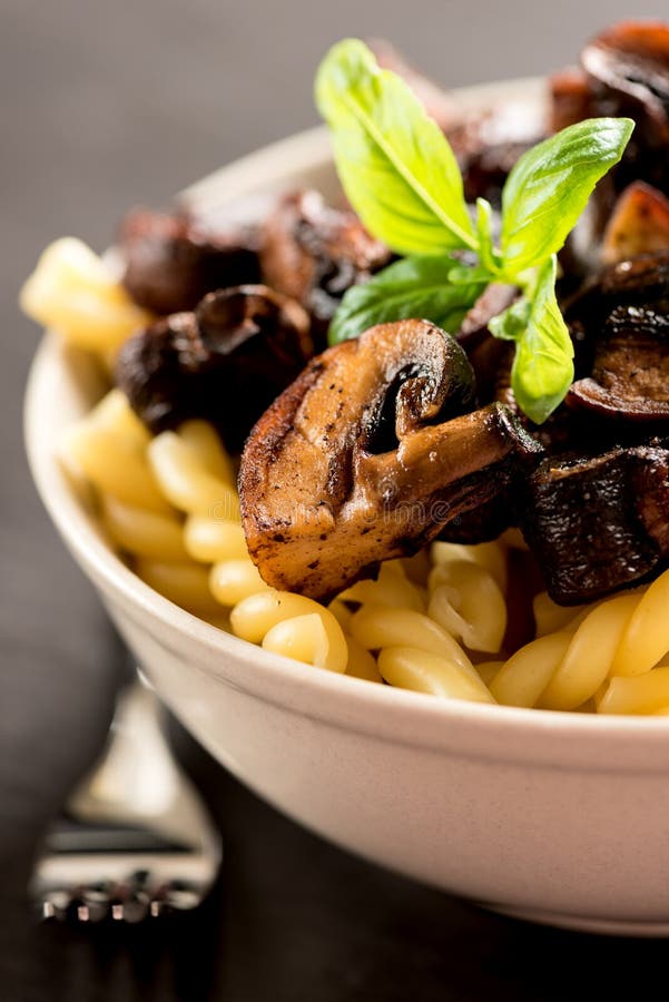 Fusilli with mushrooms stock image. Image of gastronomy - 70399739