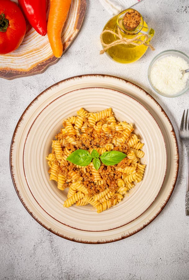 Fusilli Pasta with Minced Meat, Tomato Sauce, Cheese and Basil Stock ...