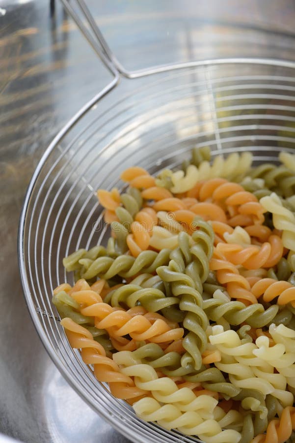 Bow tie pasta in a sieve stock image. Image of background - 31026863