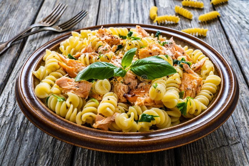 Fusilli with Roasted Salmon on Wooden Table Stock Photo - Image of herb ...