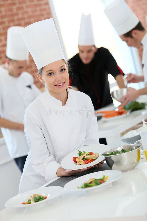 Portrait of a Cooking Apprentice Preparing Dish Stock Photo - Image of ...