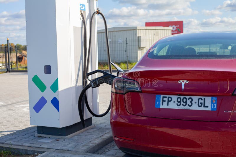 Red Tesla Model 3 at Charge Station Ignitis on Near Kaunas, Lithuania ...
