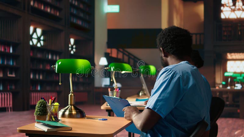 Future Nurses Studying Anatomy Class Notes in a University Library ...