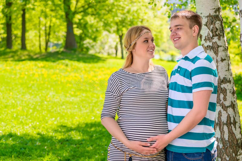 Future Parents Couple Posing in the Park Stock Photo - Image of ...