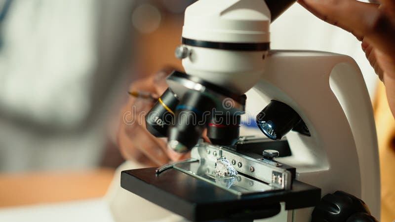 Future Researcher Works on Her Thesis by Examining Microorganisms Stock ...