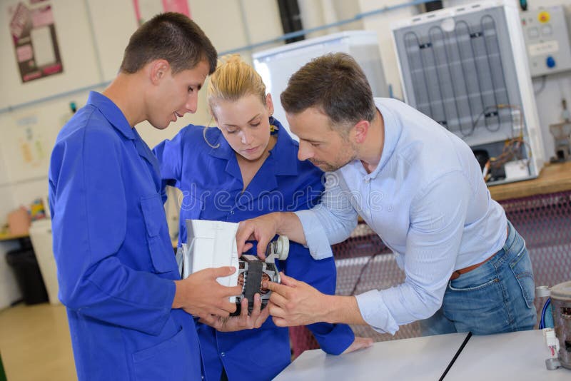 Future technicians at work stock image. Image of solving - 309328053