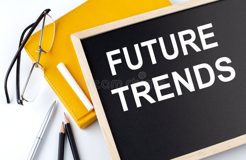 FUTURE TRENDS Text on the Blackboard with Notepad , Pen, Pencil Stock ...