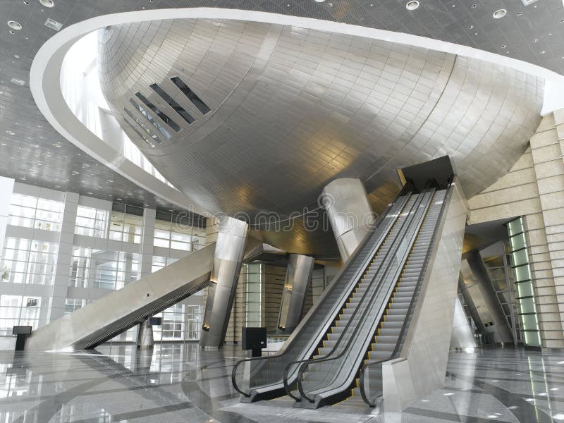 Futuristic Architecture Interior Featuring a Sleek, Metallic Escalator ...