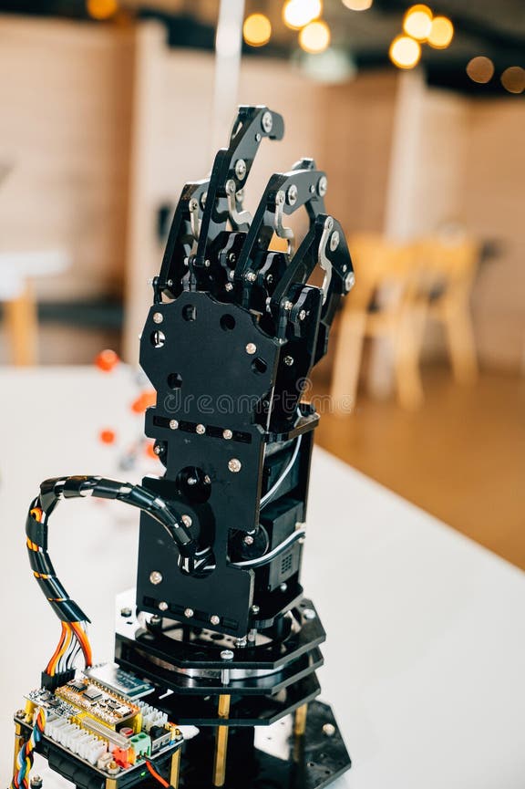 Cyborg Mechanical Arm in Action As a Black Real Robot Hand Presses on a ...