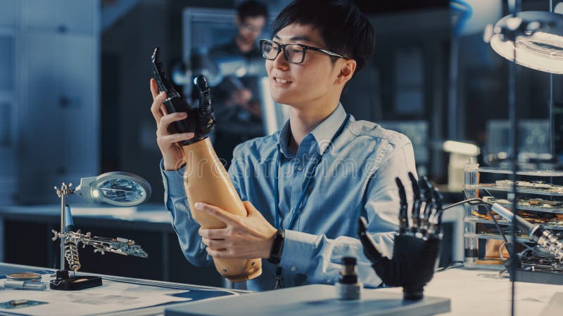 Futuristic Prosthetic Robot Arm Being Tested by a Professional Japanese ...