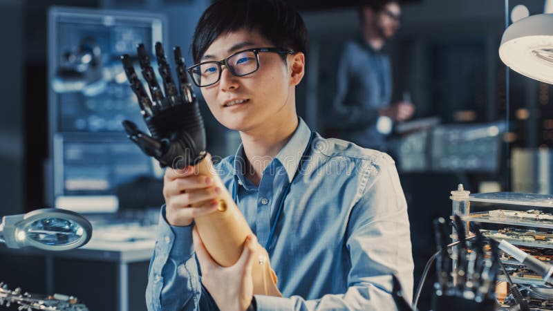 Futuristic Prosthetic Robot Arm Being Tested by a Professional Japanese ...