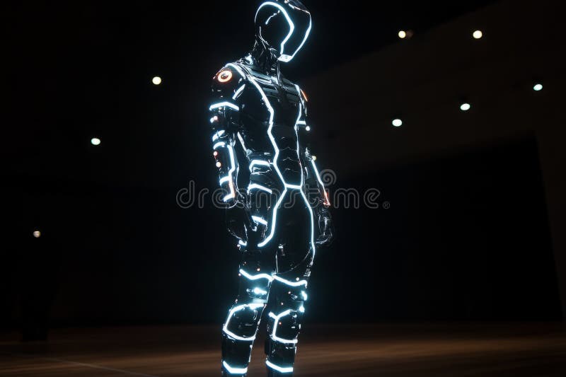 Futuristic Robot with Glowing Lines Standing in Dark Room, Showcasing ...