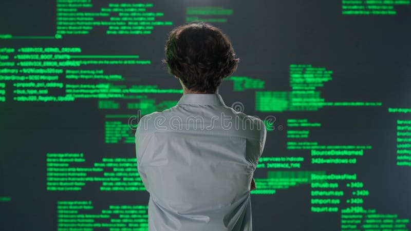 It Specialist Against Big Digital Screen. Back View Young Man Engineer ...