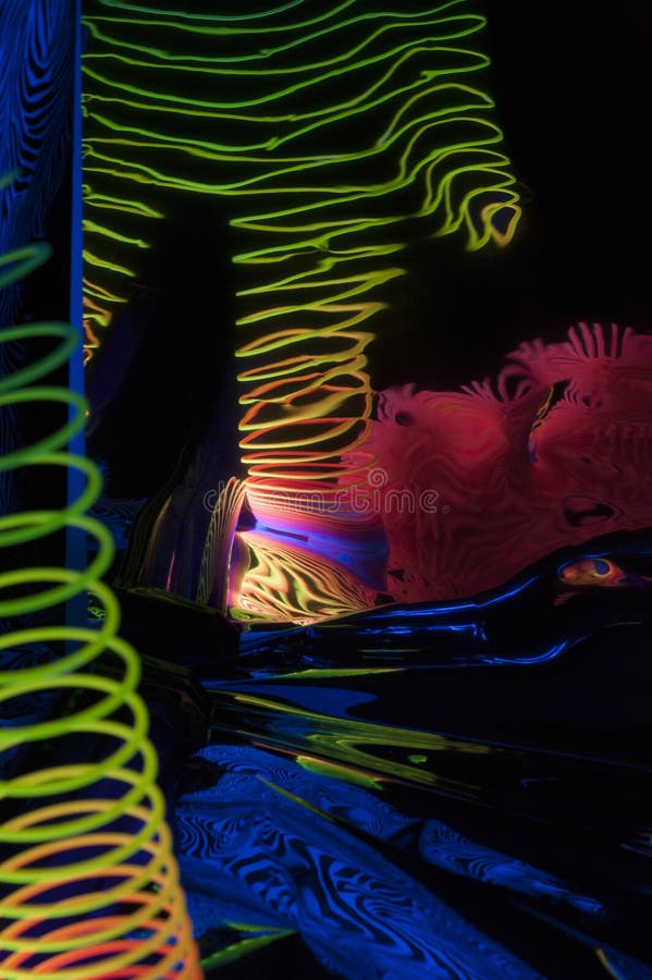 Fuzzy and Circular Objects are Lit with Fluorescent Colors Against a ...