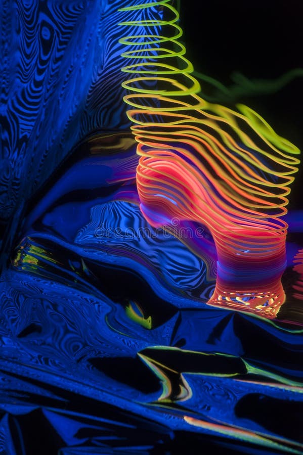 Fuzzy and Circular Objects are Lit with Fluorescent Colors Against a ...