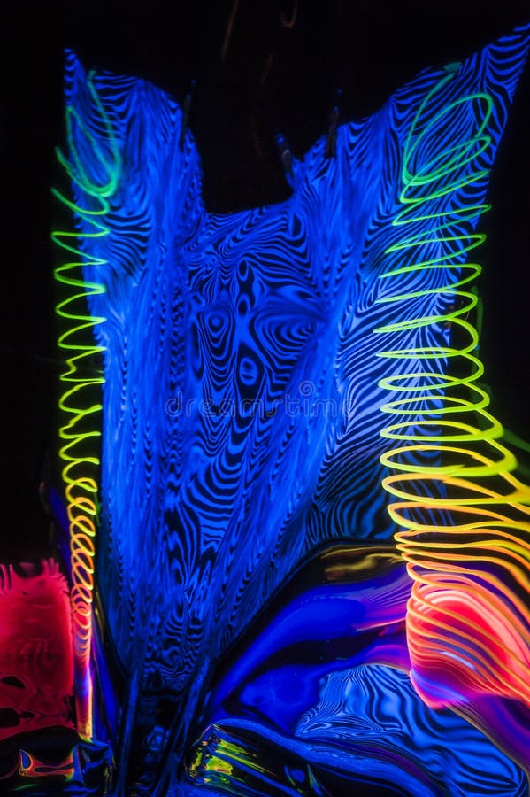Fuzzy and Circular Objects are Lit with Fluorescent Colors Against a ...