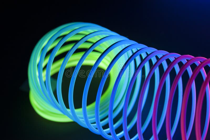 Fuzzy and Circular Objects are Lit with Fluorescent Colors Against a ...