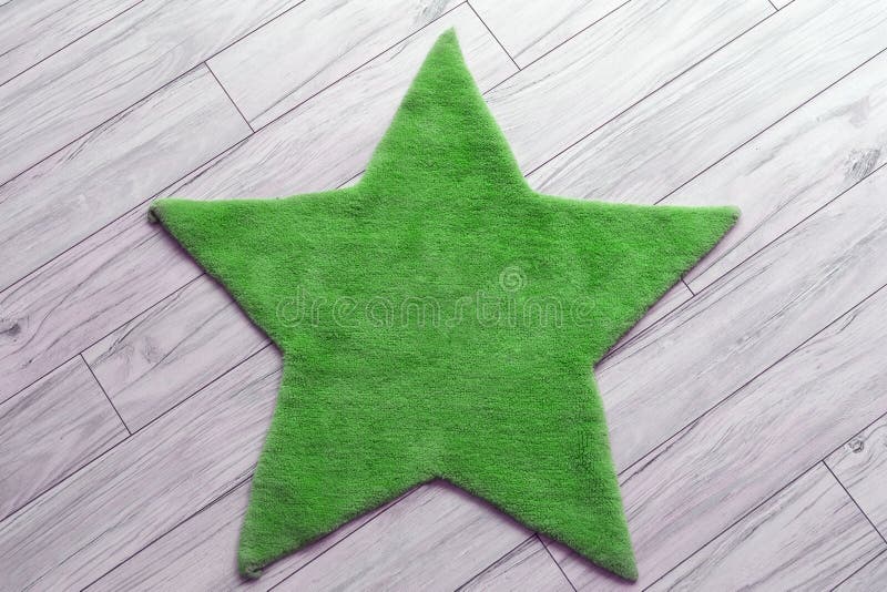 Fuzzy Star-shaped Green Carpet on Wooden Floor. Interior Element Stock ...