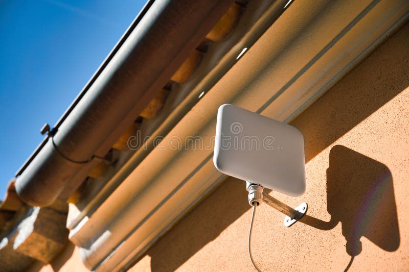 5G Fixed Wireless Access Antenna Hanging on the Wall Outside the House ...