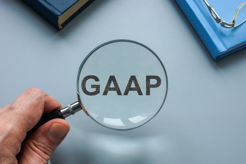 GAAP Generally Accepted Accounting Principles. a Hand with a Magnifying ...