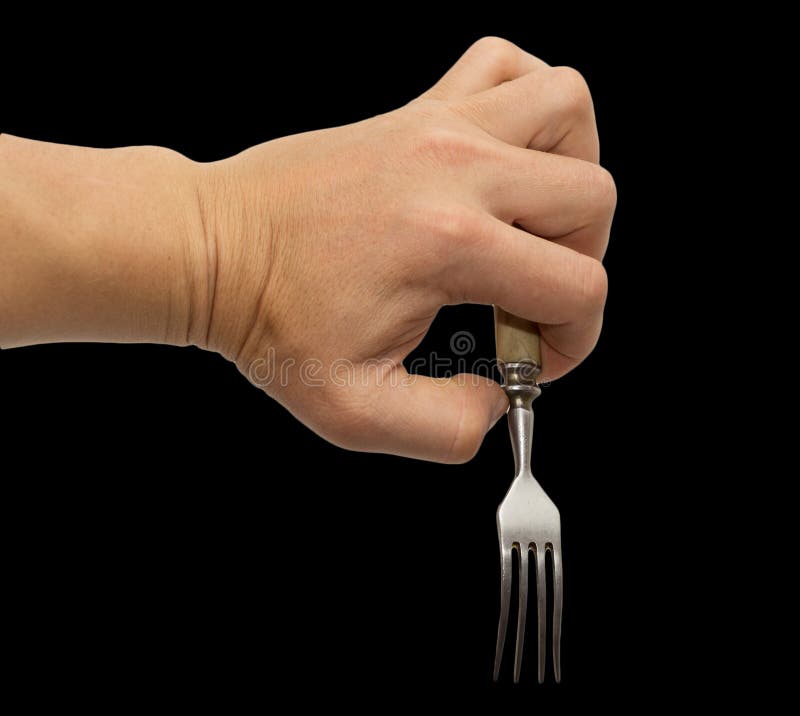 Gabel Auf Einem Schwarzen Hintergrund in Der Hand Speisen Stockfoto ...
