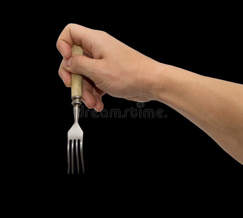 Gabel Auf Einem Schwarzen Hintergrund in Der Hand Speisen Stockfoto ...