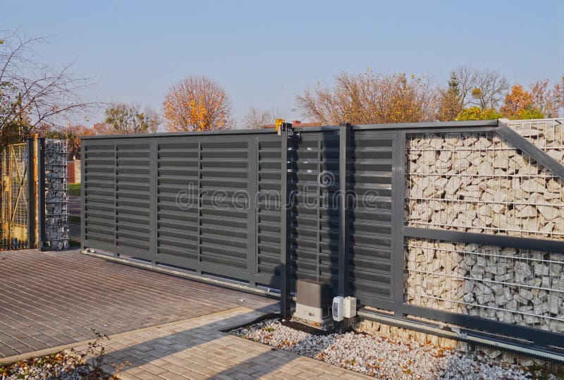 Gabion. Automatic Entrance Gate Used in Combination with a Wall Made of ...
