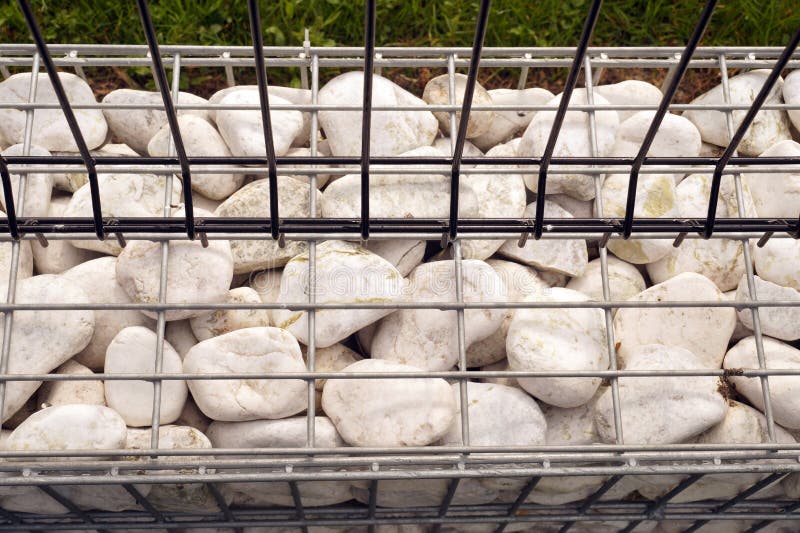 Gabion. a Low Foundation Under a Steel Openwork Fence Stock Photo ...